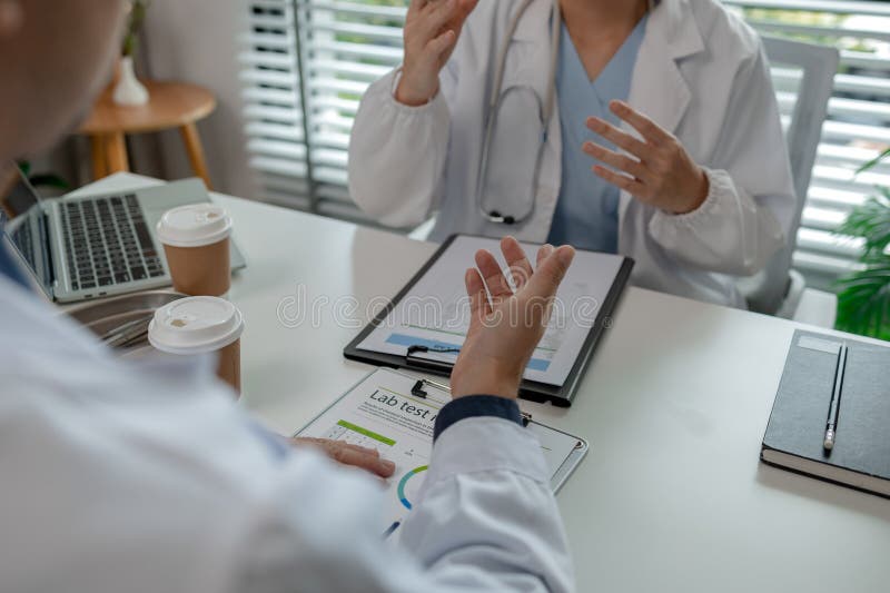 Two Doctors Sat in a Private Office at the Hospital Discussing and ...