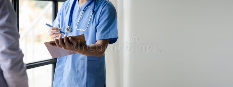 Two Doctors Stand in a Conference Room Discussing, Brainstorming on How ...
