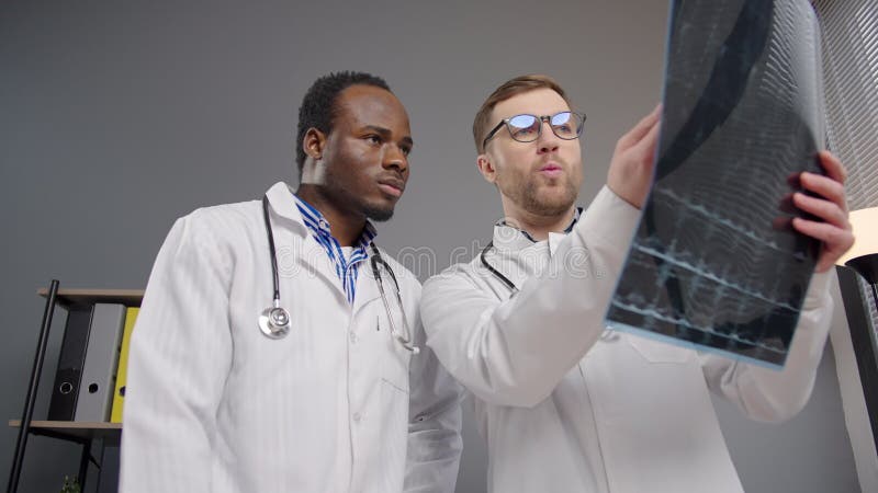 Two Doctors Discussing Patients Test Results on X-ray Stock Video ...