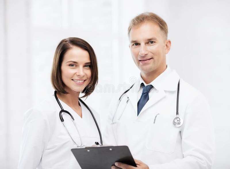 Two Doctors with Stethoscopes Stock Photo - Image of paramedics ...
