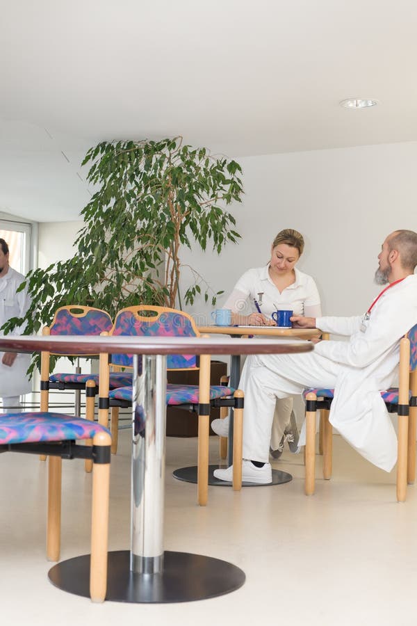 Two Doctors Take Their Lunch Break Stock Photo - Image of nurse ...