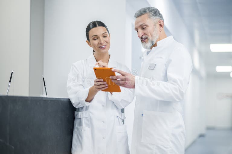 Two Doctors Talking in the Hospital during the Shift Change Stock Photo ...