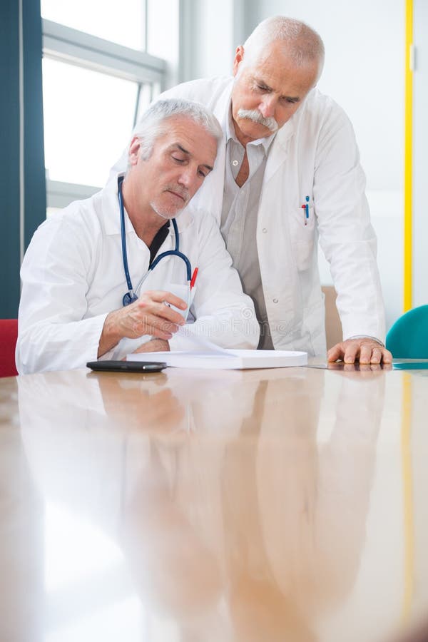 Two Doctors Talking at Modern Hospital Stock Image - Image of foyer ...