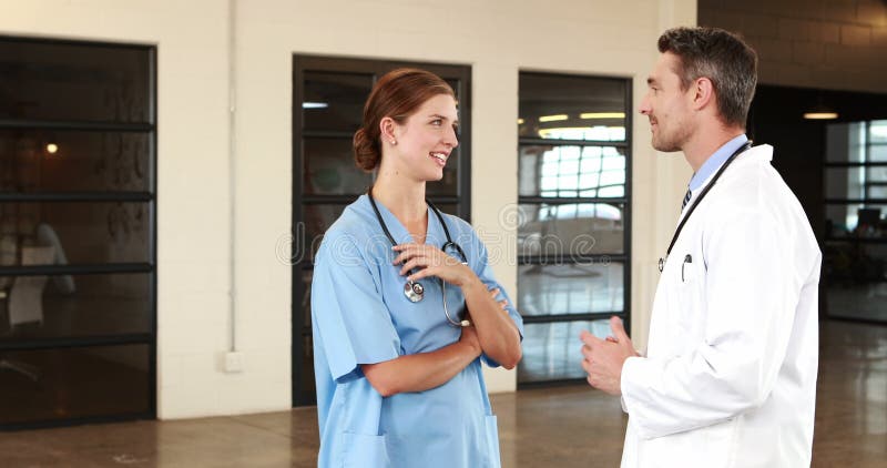 Two Doctors Talking Together Stock Video - Video of communication ...
