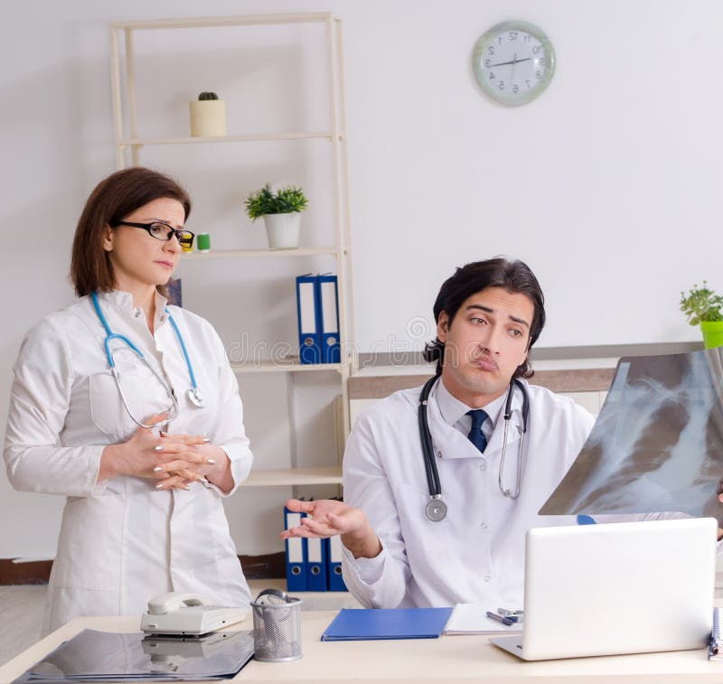 Two Doctors Working in the Clinic Stock Image - Image of practitioner ...