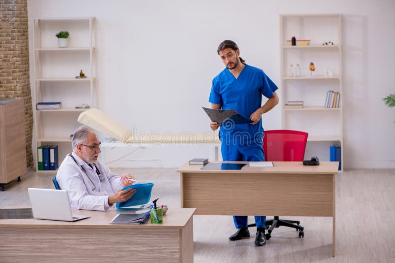 Two Doctors Working in the Clinic Stock Image - Image of care, medicine ...