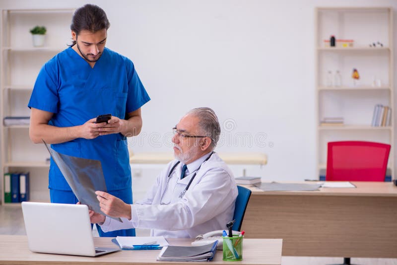 Two Doctors Working in the Clinic Stock Photo - Image of colleague ...