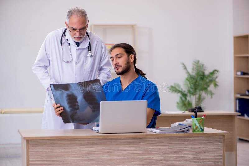 Two Doctors Working in the Clinic Stock Photo - Image of discussing ...