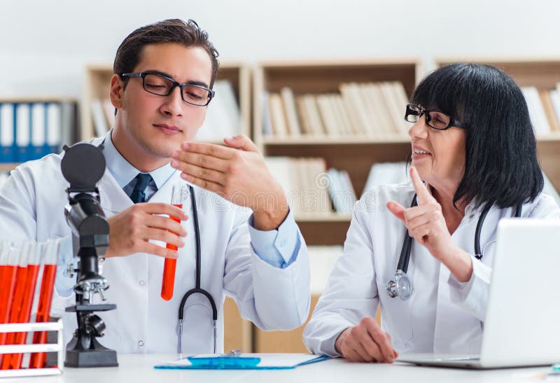 Two Doctors Working in the Lab Stock Image - Image of medicine, health ...
