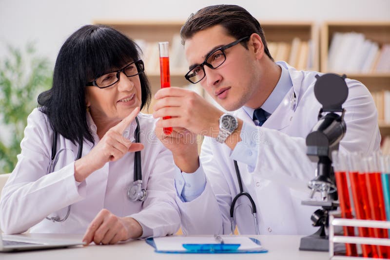 The Two Doctors Working in the Lab Stock Image - Image of medical, blue ...