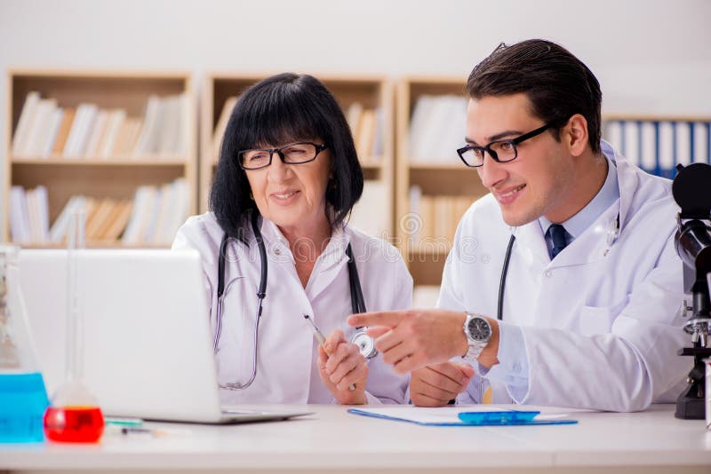 The Two Doctors Working in the Lab Stock Photo - Image of doctor ...