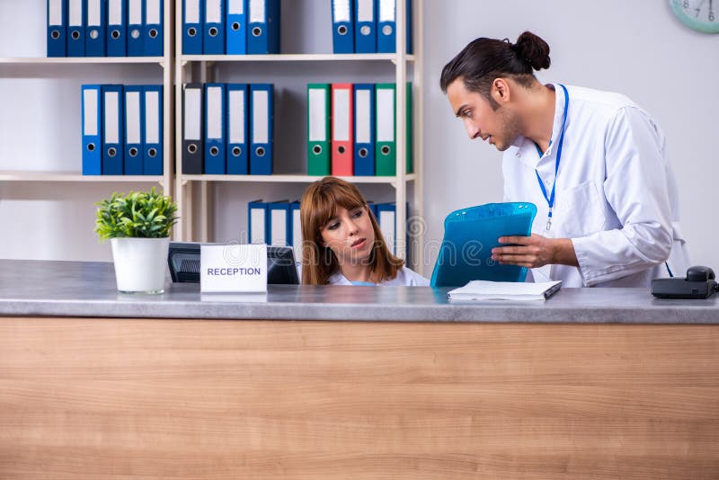 Two Doctors Working at the Reception in the Hospital Stock Image ...