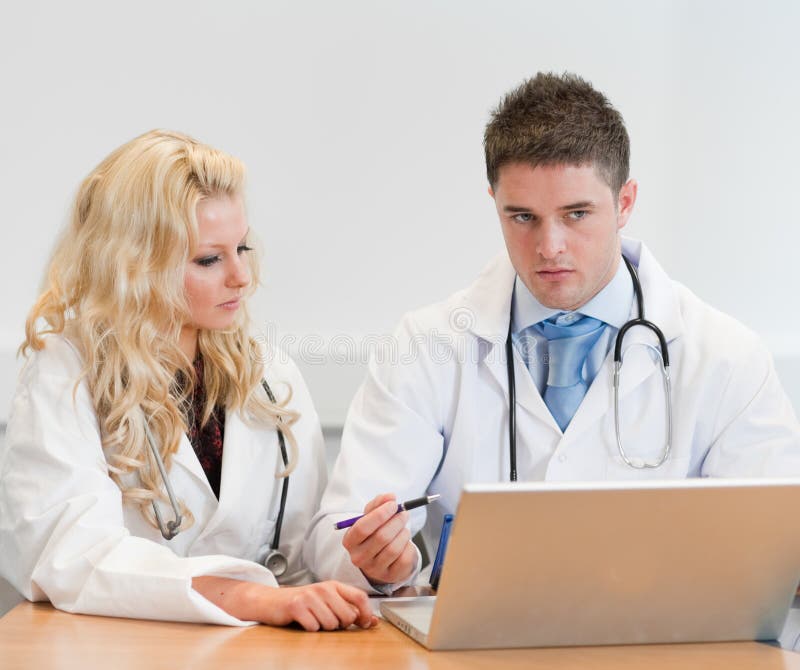 Two Doctors Working Together Stock Image - Image of person, friendly ...