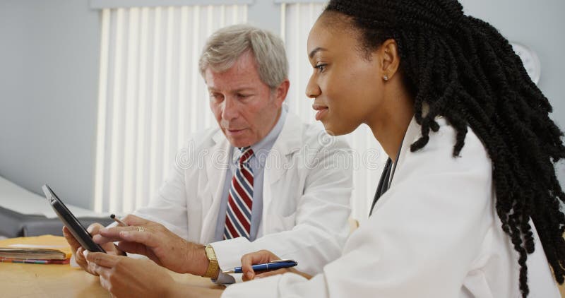 Two Doctors Working Together Stock Photo - Image of office, occupation ...