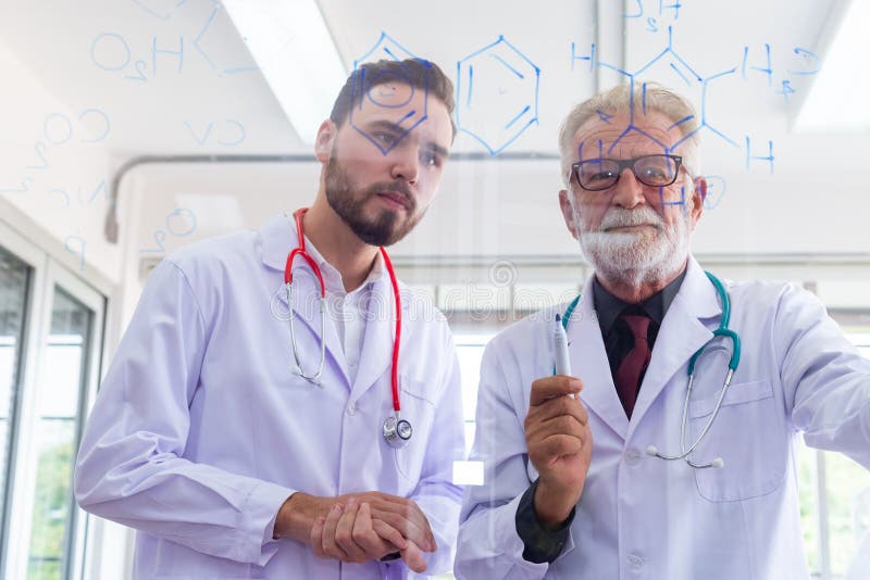 Two Doctors Writing Formula Analyzing Data on Glass Board Stock Image ...