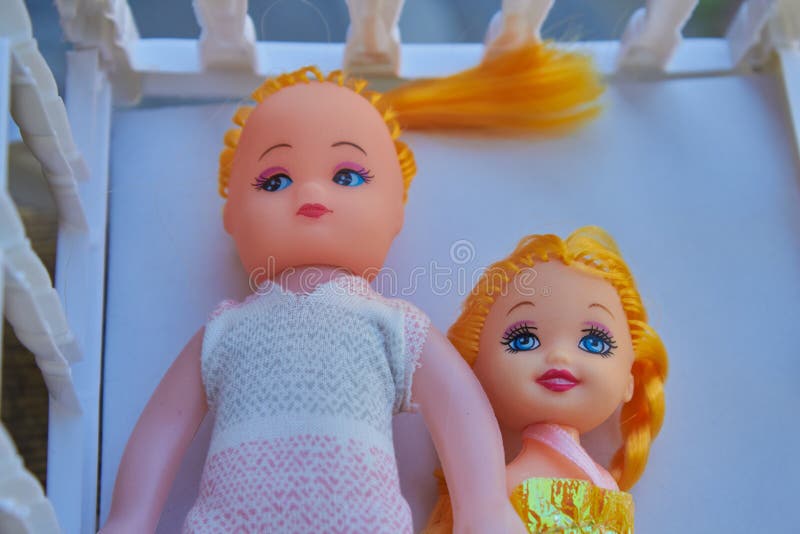 Two Dolls in a Cradle,toys, Dolls Sleep in a Children`s Cradle Stock ...