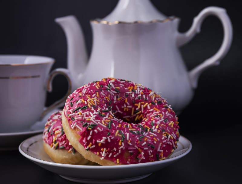 Two Donuts with Icing on a Black Background Close-up Stock Photo ...
