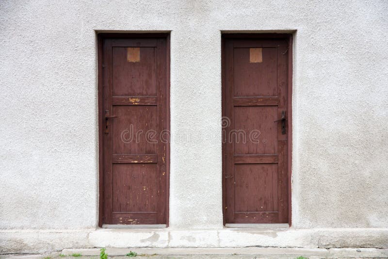 Two doors stock image. Image of stone, wall, locked, doors - 37080321