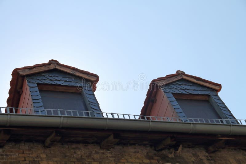 Two Dormer Windows on an Old, Decaying Brick Building Stock Photo ...