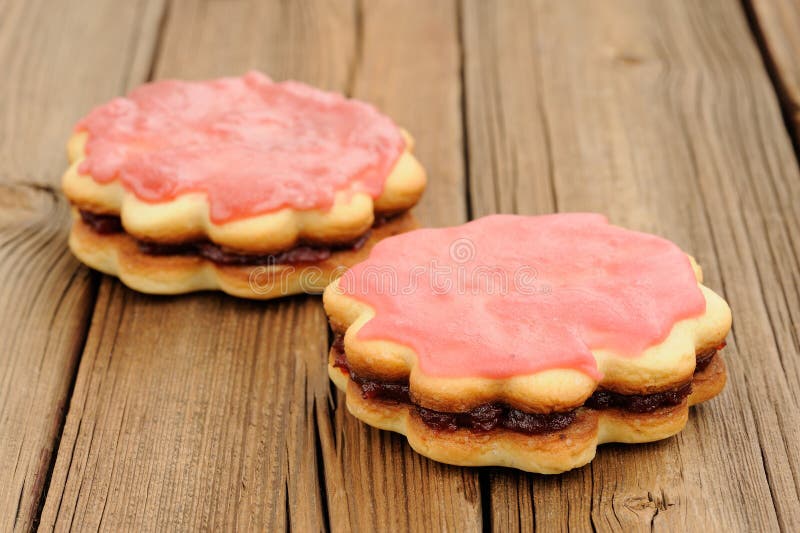 Two Double Round Sand Cakes Decorated with Pink Icing and Jam on Stock ...