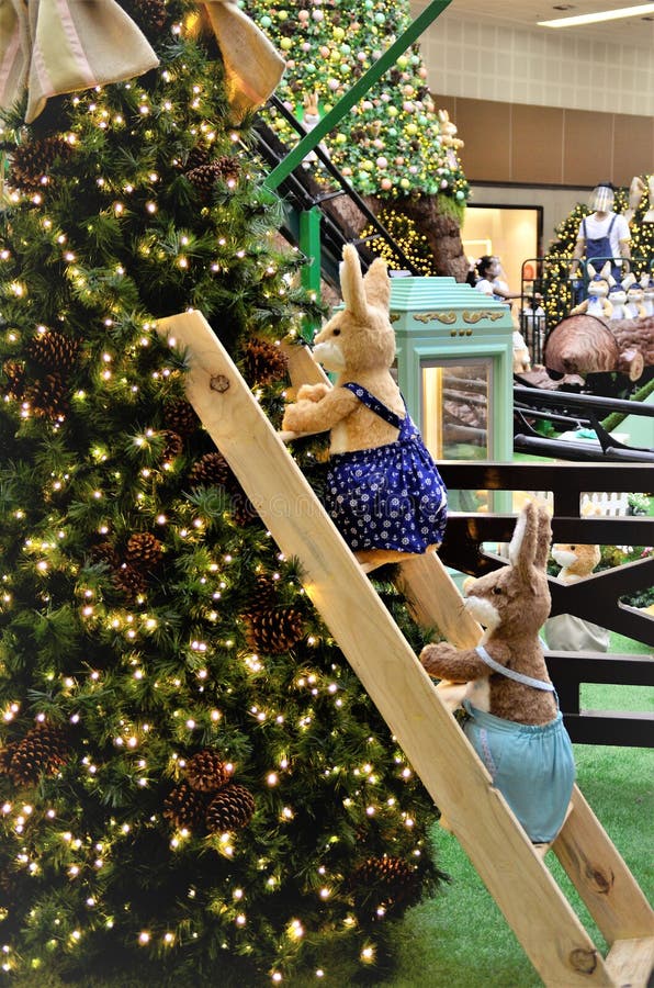 Dressed Rabbits Climbing Stairs To the Christmas Tree Stock Photo ...