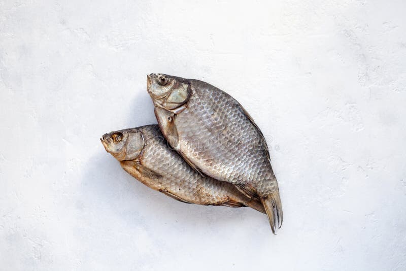 Two Dried Fish Carp on a White Concrete Background Stock Image - Image ...