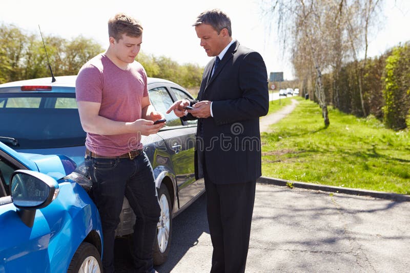Two Drivers Exchange Insurance Details after Accident Stock Image ...