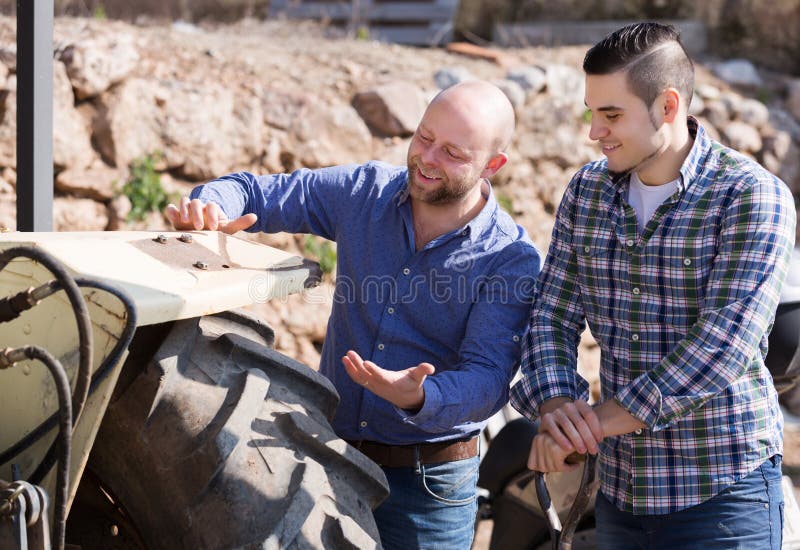 Two Drivers Working with Tractor Stock Photo - Image of operator ...