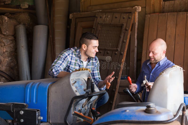 Two Drivers Working with Tractor Stock Photo - Image of operator ...