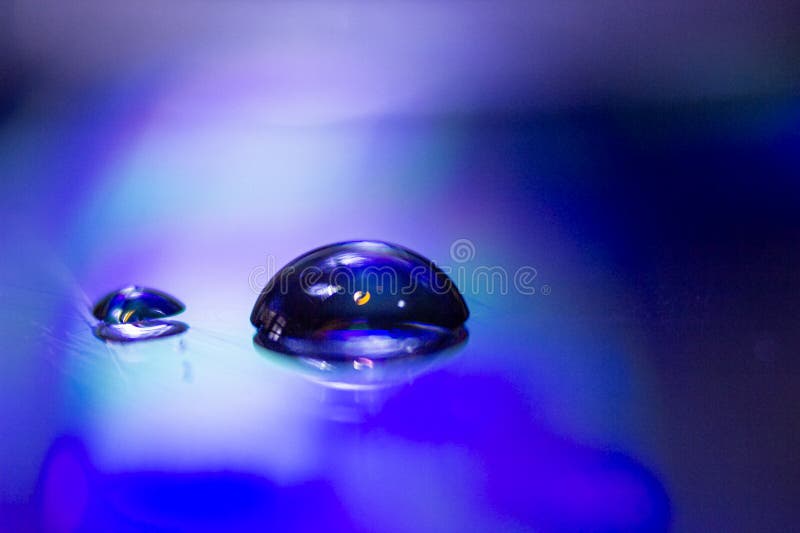 Two Drops of Water on a CD, Illuminated by Artificial Light. it Was ...