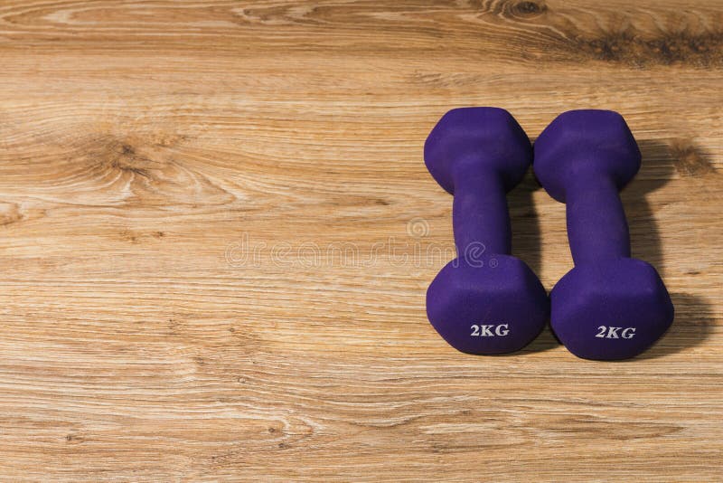Two Dumbbells of 2 Kilograms on a Wooden Background Stock Image - Image ...