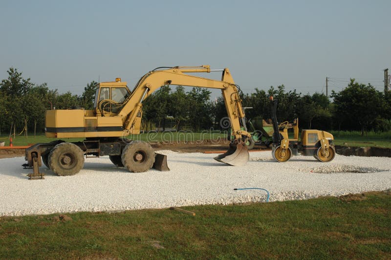 Two earth movers stock image. Image of load, soil, machinery - 1025735