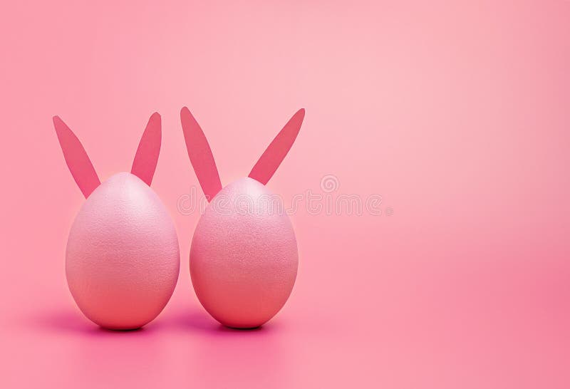 Two Easter Pink Eggs with Bunny Ears on a Pink Background. Happy Easter ...