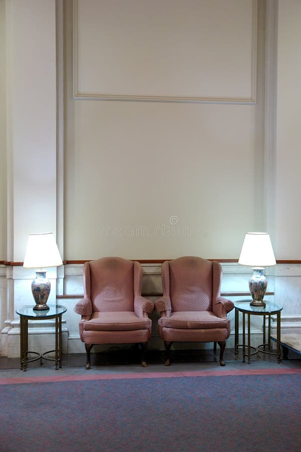Two Easy Chairs in Lobby with High Ceiling Stock Image - Image of lamps ...