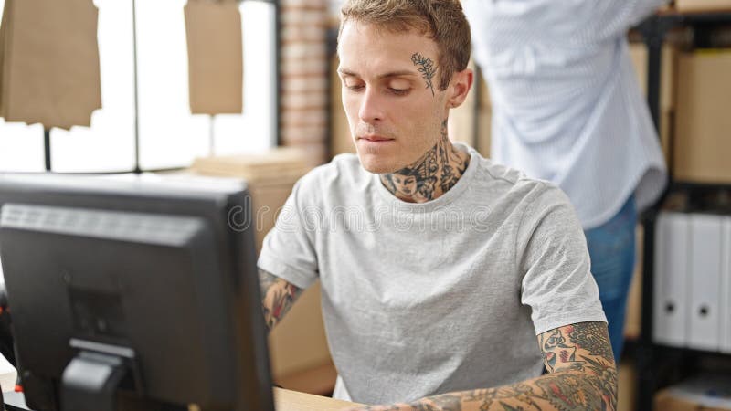 Two Ecommerce Business Workers Using Computer Taking Notes at Office ...