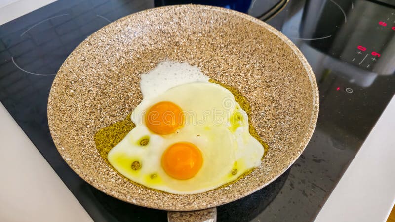 Two Eggs Cracked in a Pan on the Stove Stock Image - Image of shopping ...