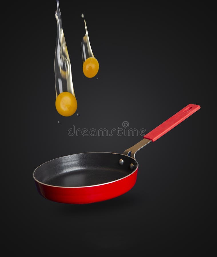 Two Eggs Falling into the Pan - Breakfast Cooking Concept Stock Photo ...