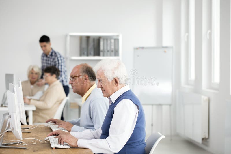 Elder men using computers stock image. Image of room - 97689613