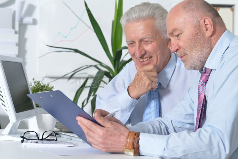 Two Old Business Men Sitting at Desk and Working Stock Photo - Image of ...