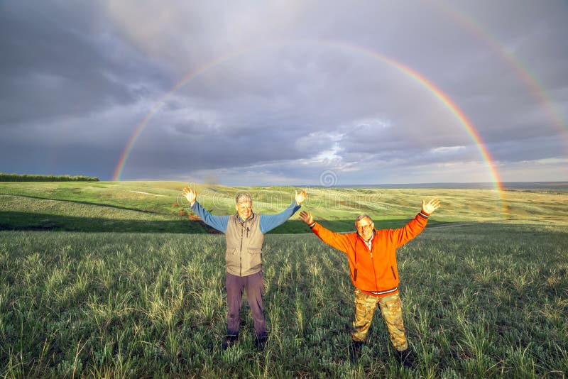 Two Elderly Men Raised Their Hands Up and Rejoice Beautiful Big Rainbow ...