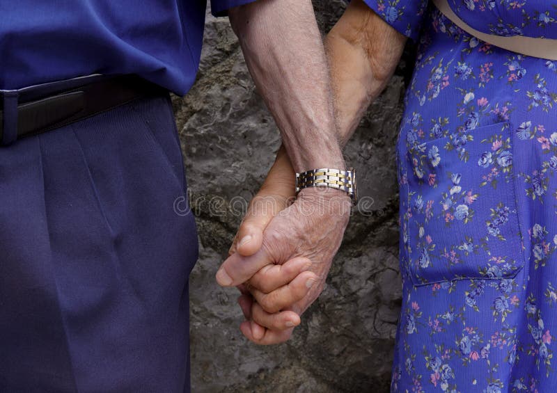Two Elderly People Shaking Hands. Foreground Stock Image - Image of ...