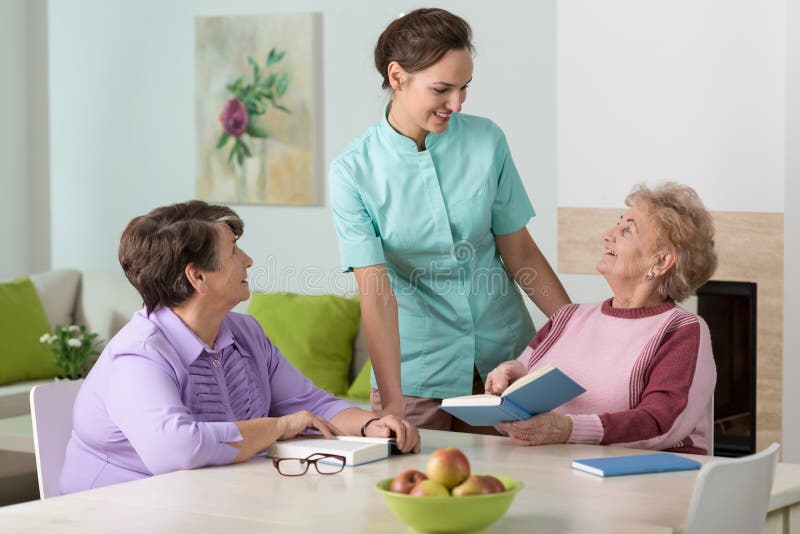Two Elderly Women and a Friendly Nurse Stock Image - Image of ...
