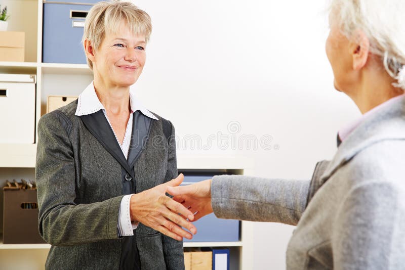 Two Elderly Women Shaking Hands Stock Image - Image of business ...