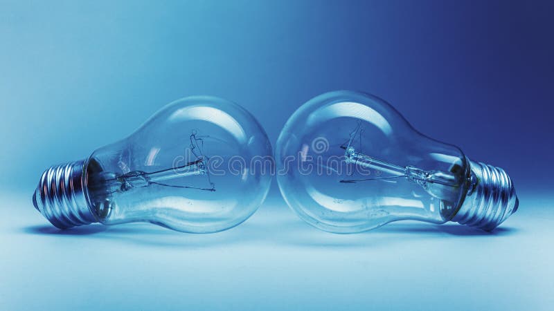 Two Electric Bulbs in Blue stock image. Image of reflections - 67689299