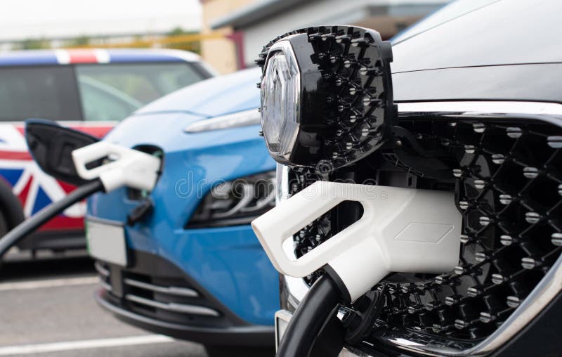 Two Electric E Cars on Charge at a Public Charging Point Front End ...