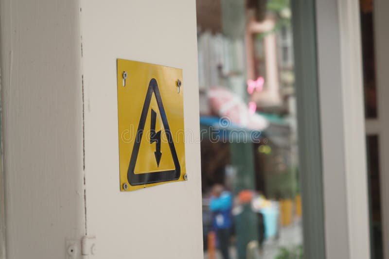 Two Electrical Boxes with Lightning Bolt on Brick Wall Stock Photo ...