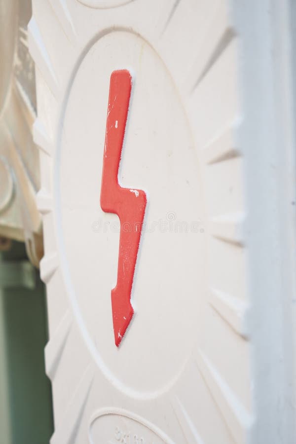 Two Electrical Boxes with Lightning Bolt on Brick Wall Stock Image ...