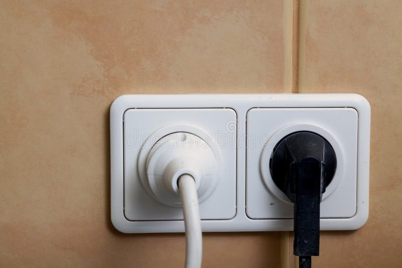 Two Electrical Plugs in Double Socket Close-up Stock Photo - Image of ...
