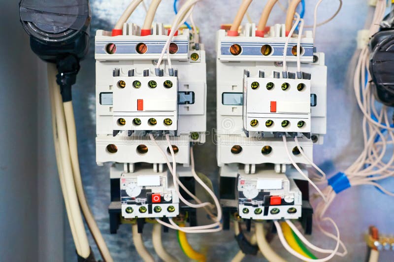 Two Electrical Relays Connected by Wires on a Metal Background. Stock ...
