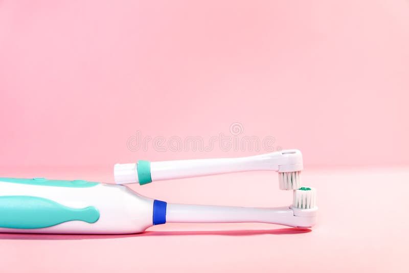Electrical Toothbrushes on a Soft Light Pink Background Stock Photo ...
